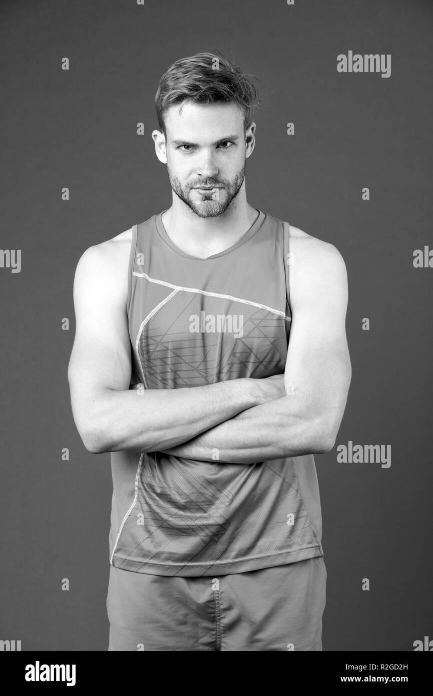 Proud to be strong. Man sporty outfit looks serious and strict with ...