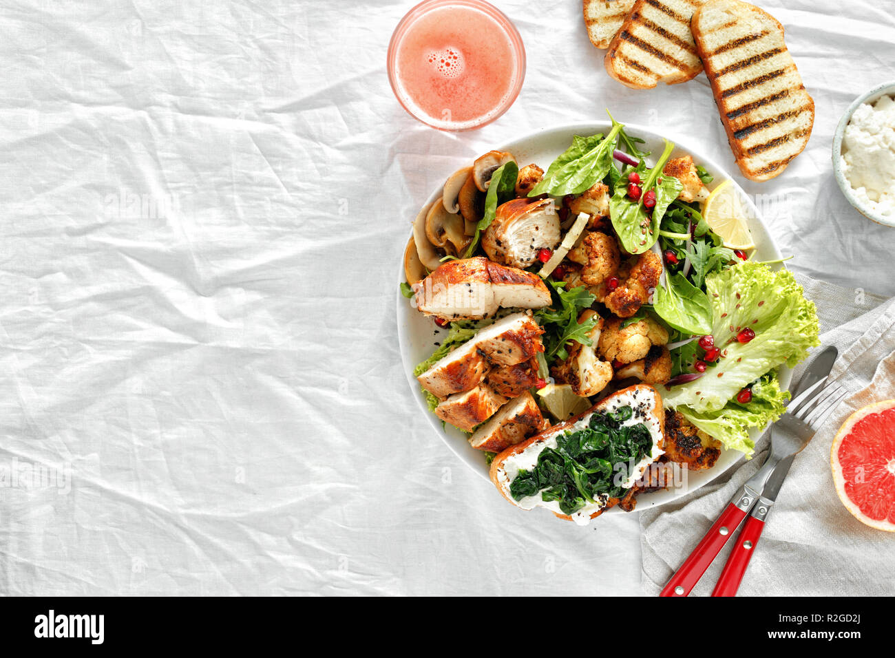 Lunch food bowl of fresh salad with hicken steak and fried cauliflower ...