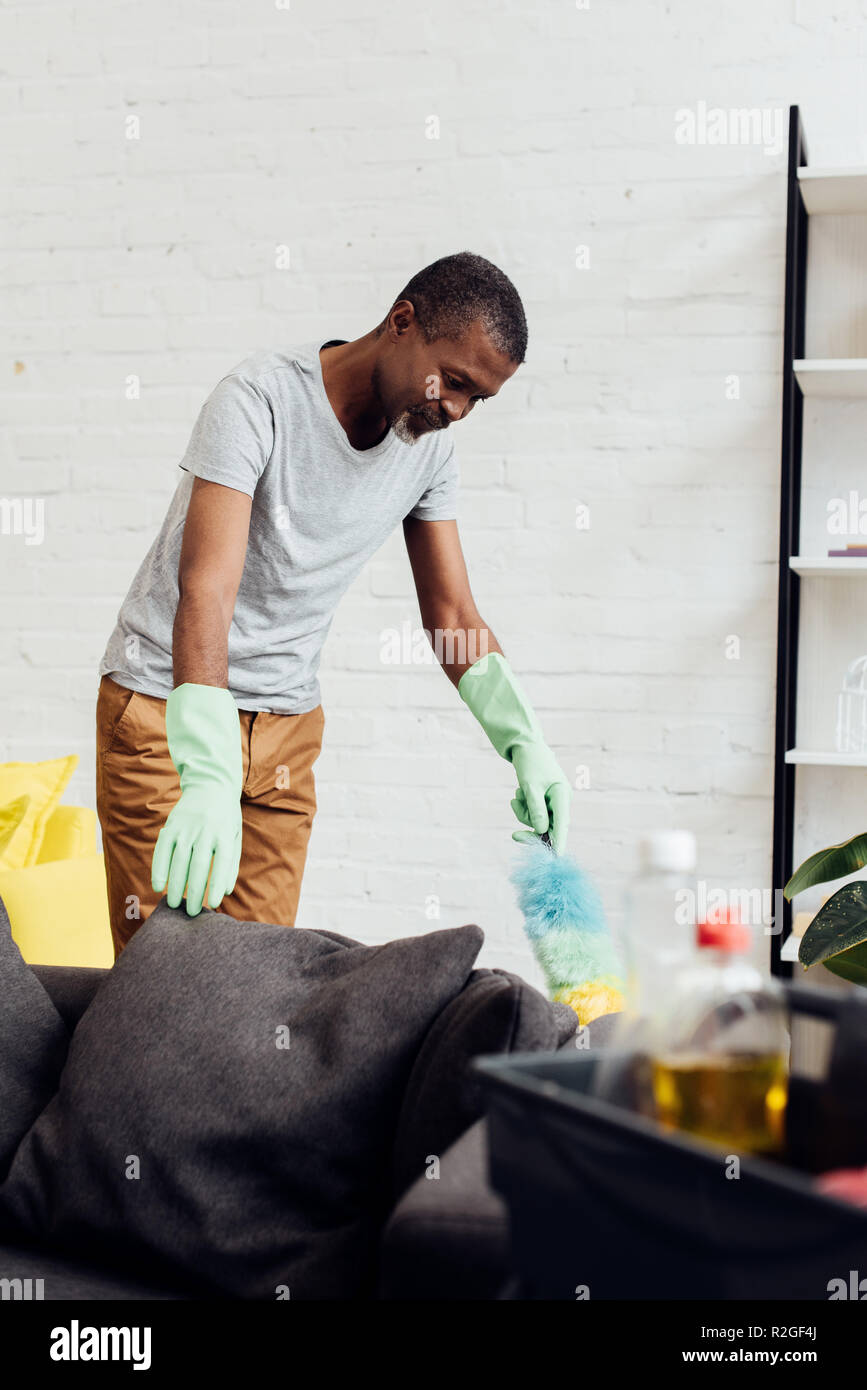 Black man doing housework hi-res stock photography and images - Alamy