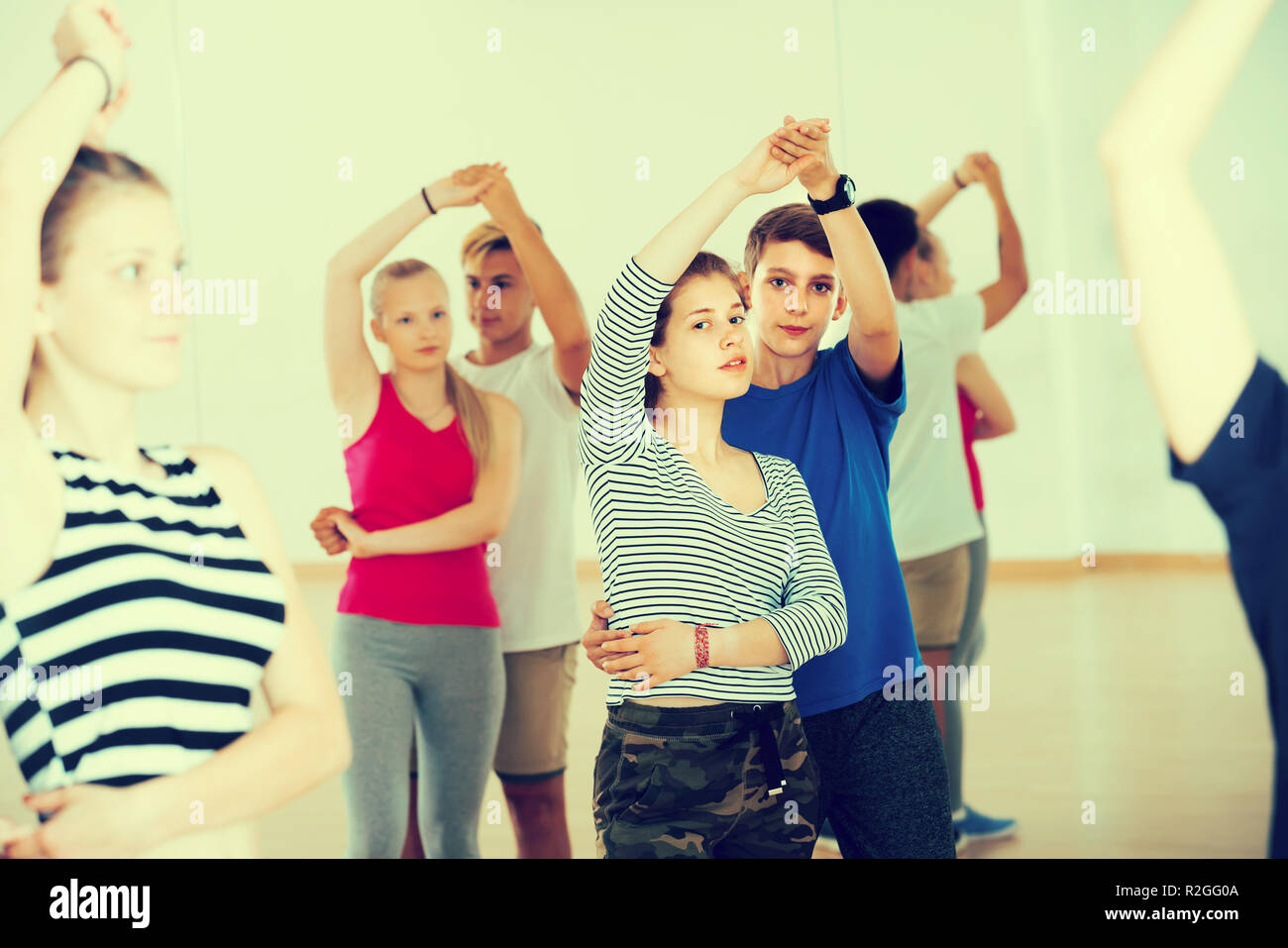Smiling children having dancing class in classroom Stock Photo - Alamy