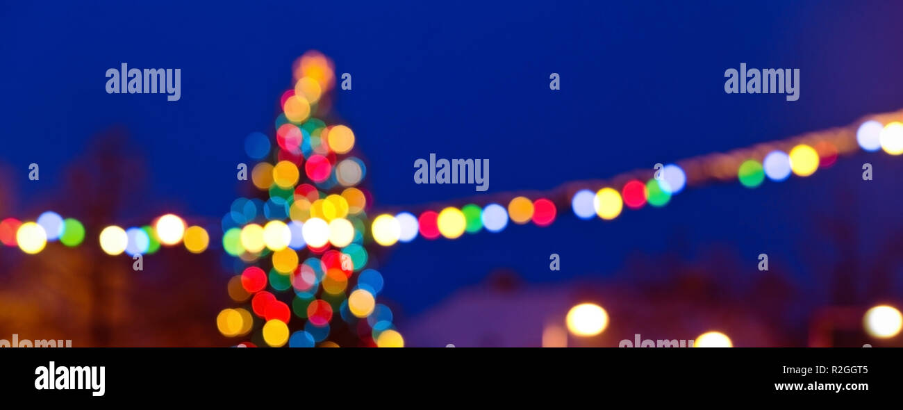 Christmas background with unfocused Christmas tree by night Stock Photo ...