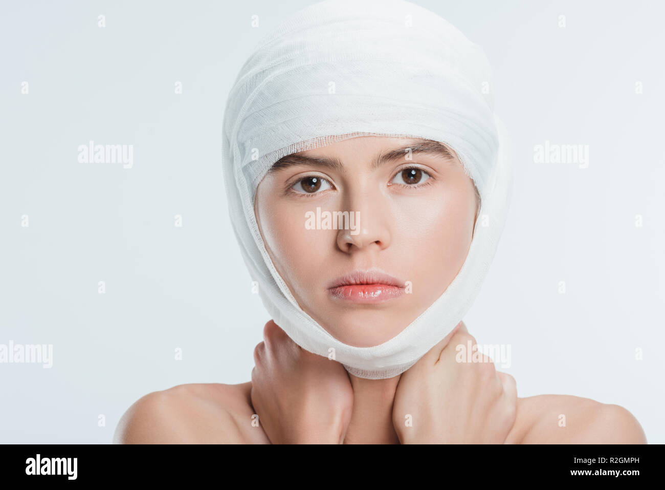 close up of adult woman with bandages on head isolated on white Stock ...