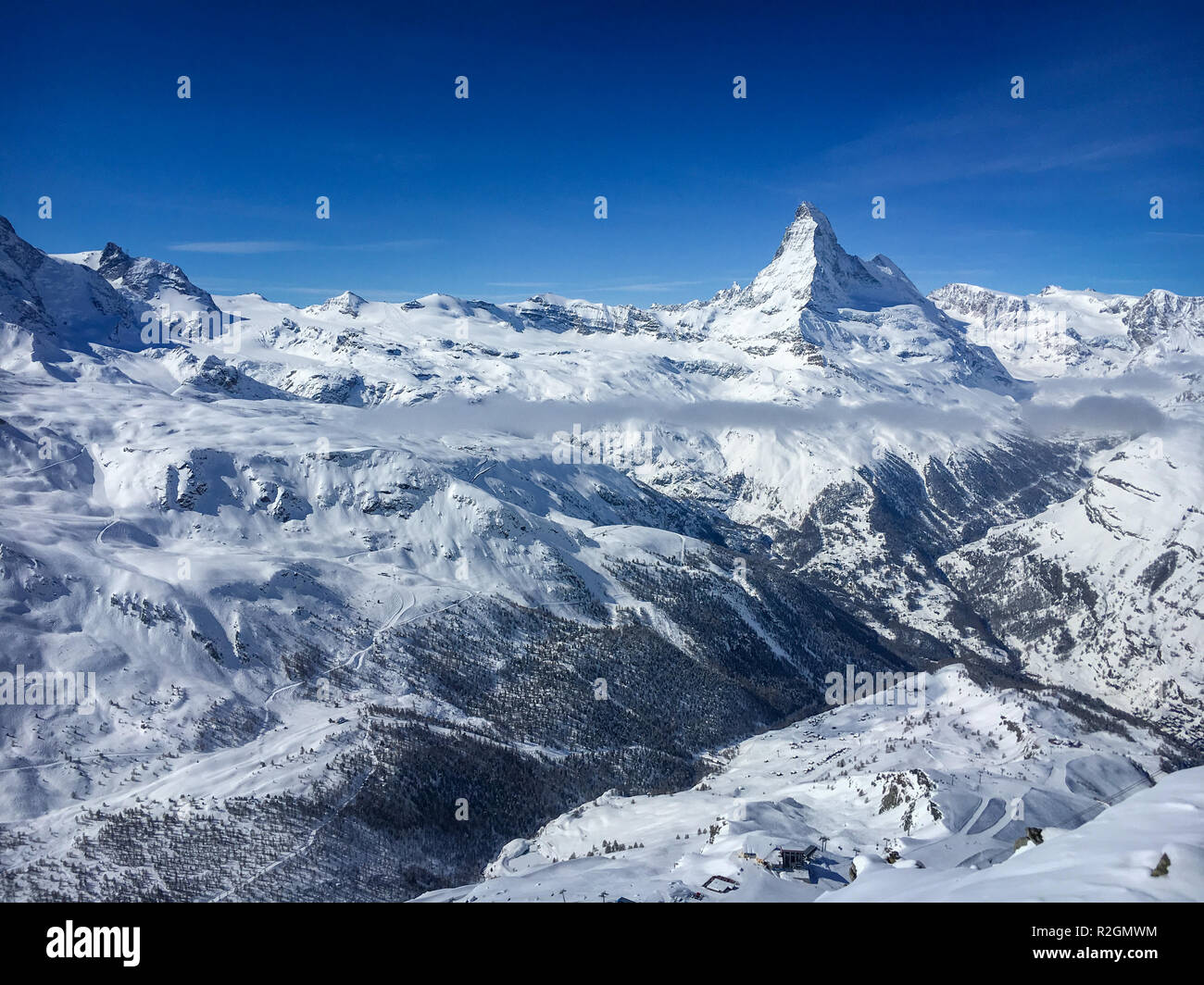 Majestic Matterhorn mountain in front of a blue sky with clouds seen ...
