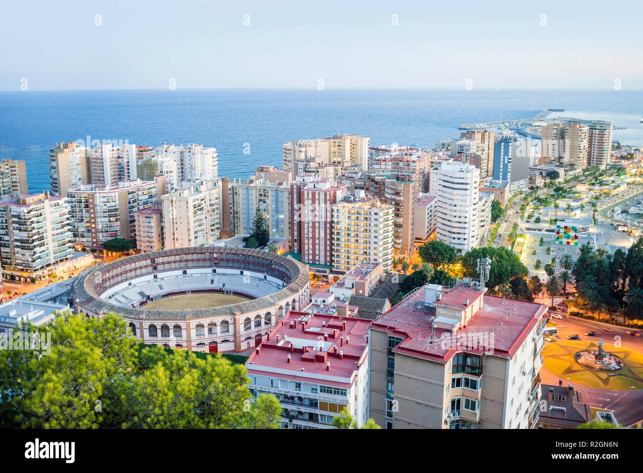 Malaga bullring surrounded by residential buildings next to the sea ...