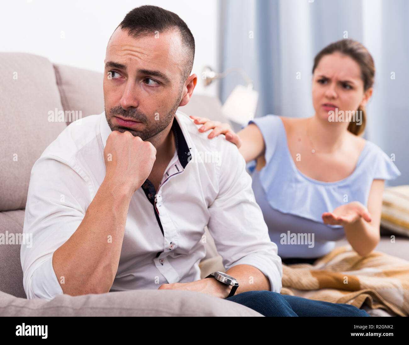 Sad male is depressing and husband is supporting him at home Stock ...