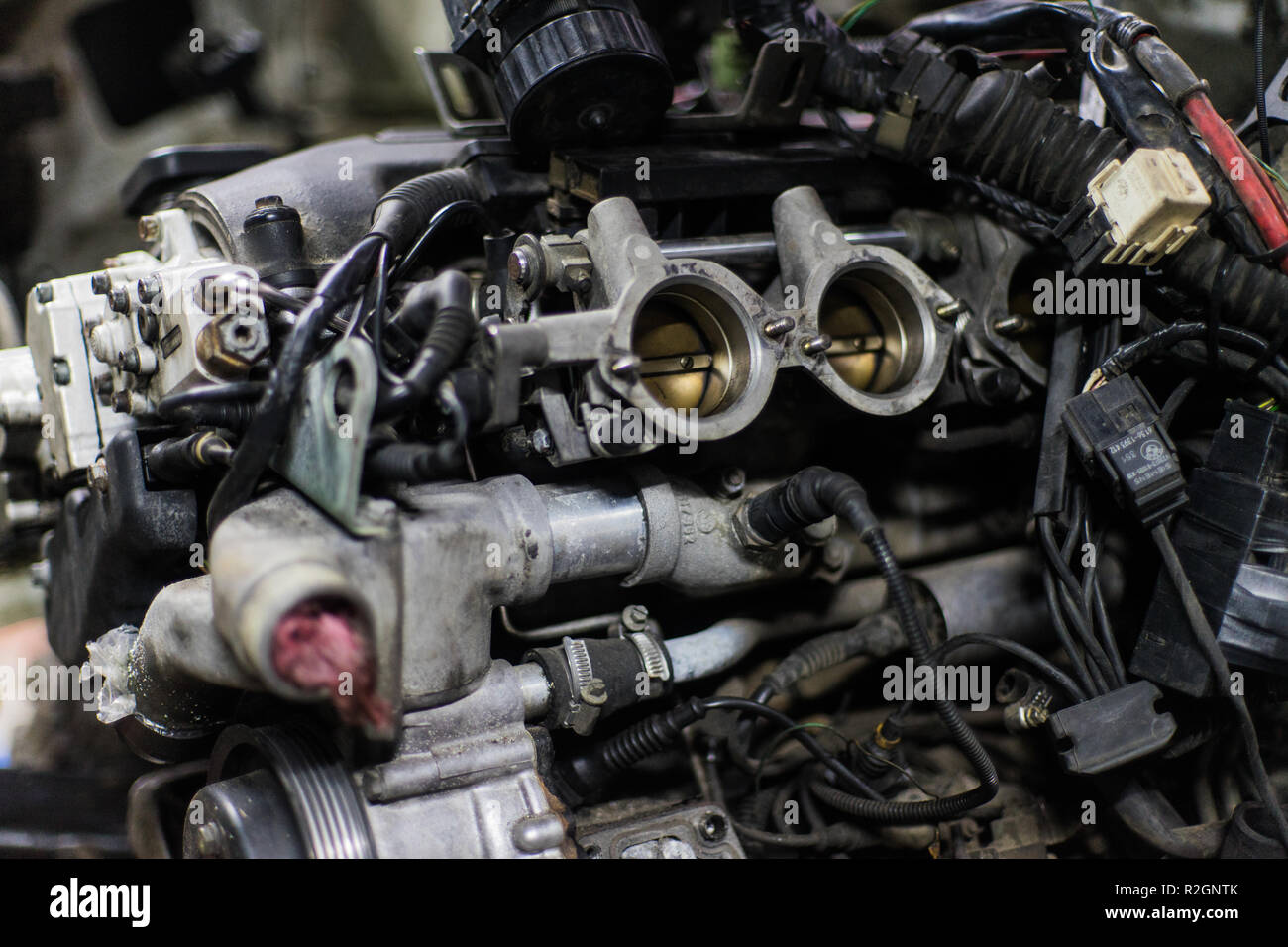 Legendary modern sport engine in car with open hood and raw parts Stock ...