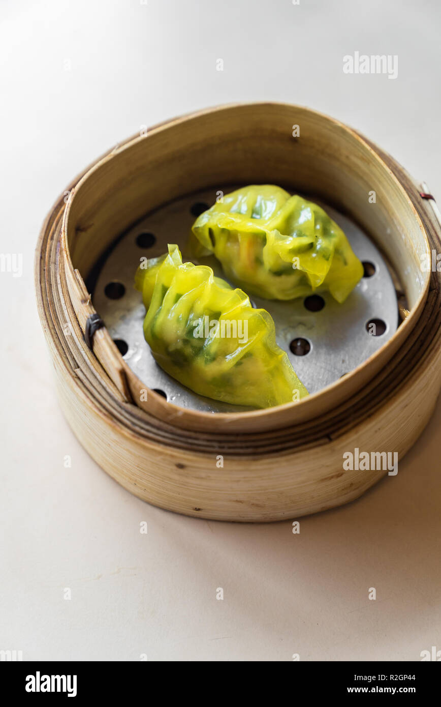 Chinese dim sum in wooden basket Stock Photo - Alamy