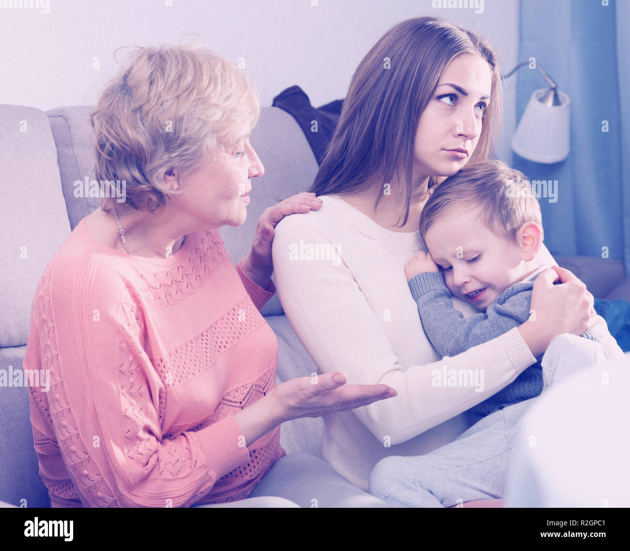 Two adult female are having disagreements with upbringing kid at home ...