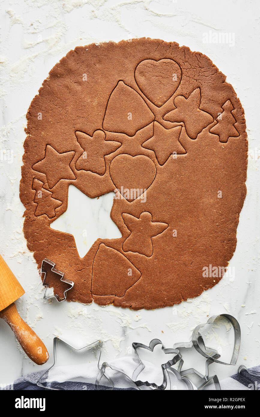 Gingerbread dough with various shape cookie cutout. Baking background ...