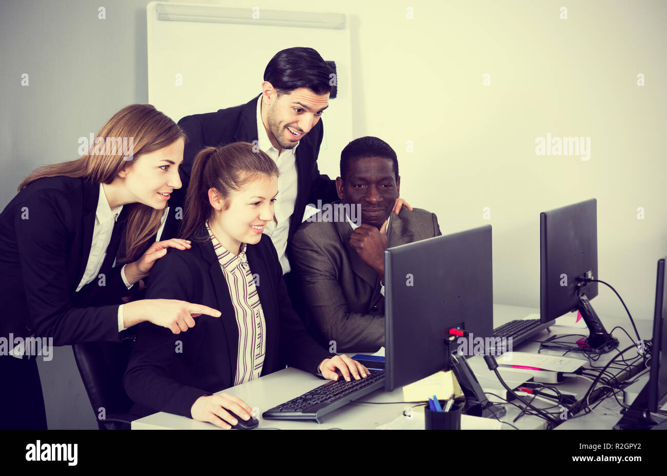 Team of managers developing strategy together in modern coworking with ...