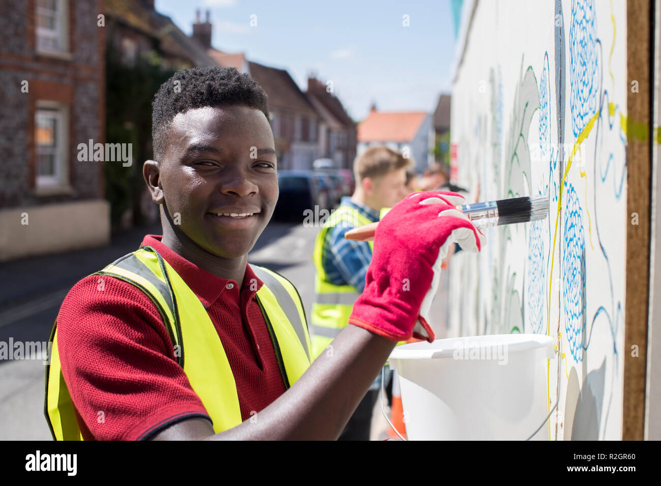Group Of Helpful Teenagers Creating And Maintaining Community Art ...