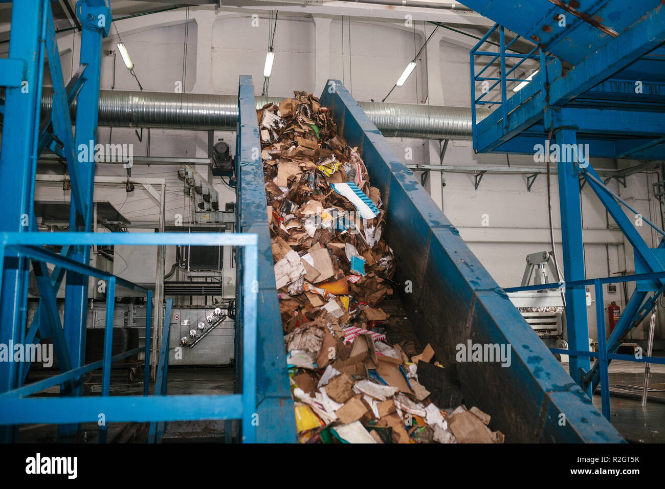 Waste sorting plant. Conveyor on which waste is moving to enter the ...