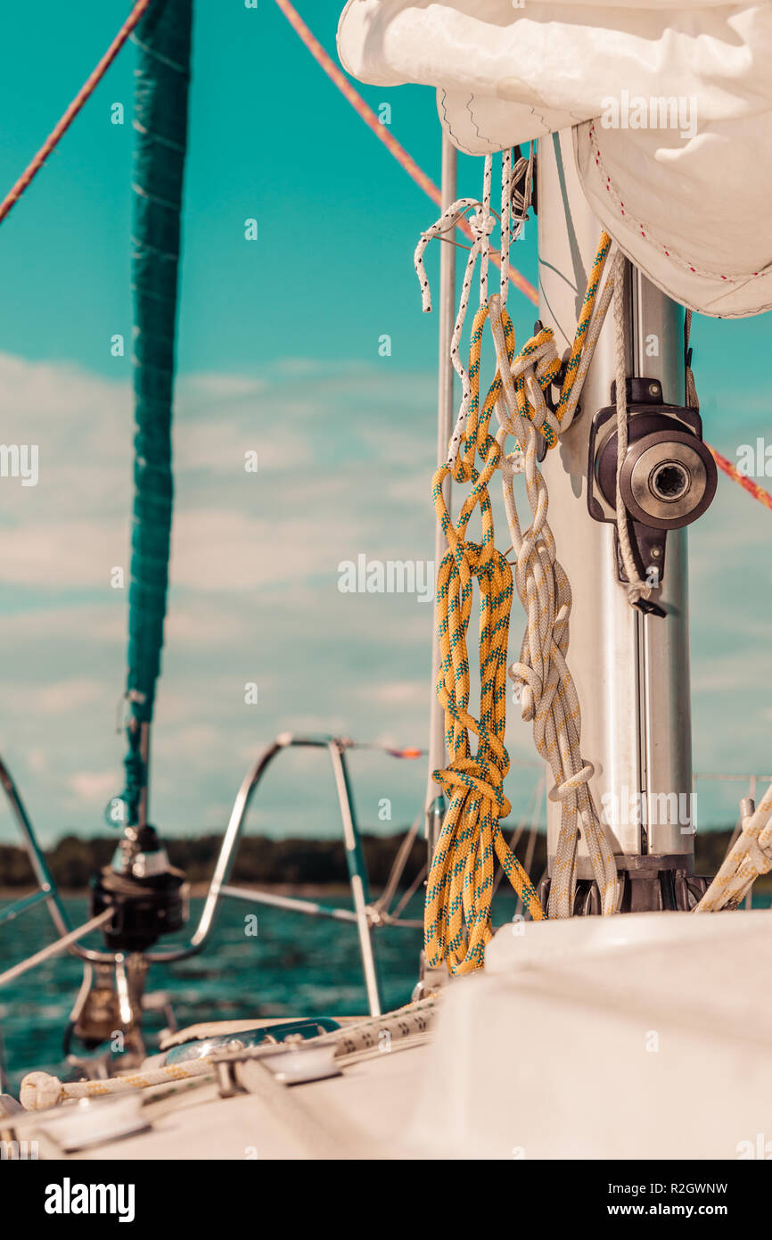 Yacht capstan with rope on sailing boat during cruise, marine objects ...