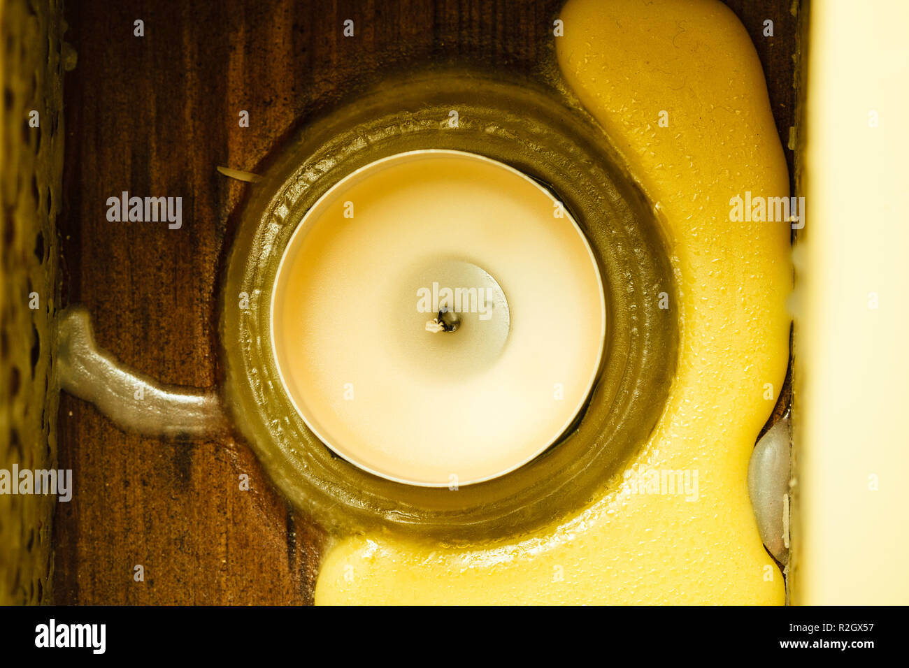 Top view detailed closeup of candle burnt out candle with spilled wax ...