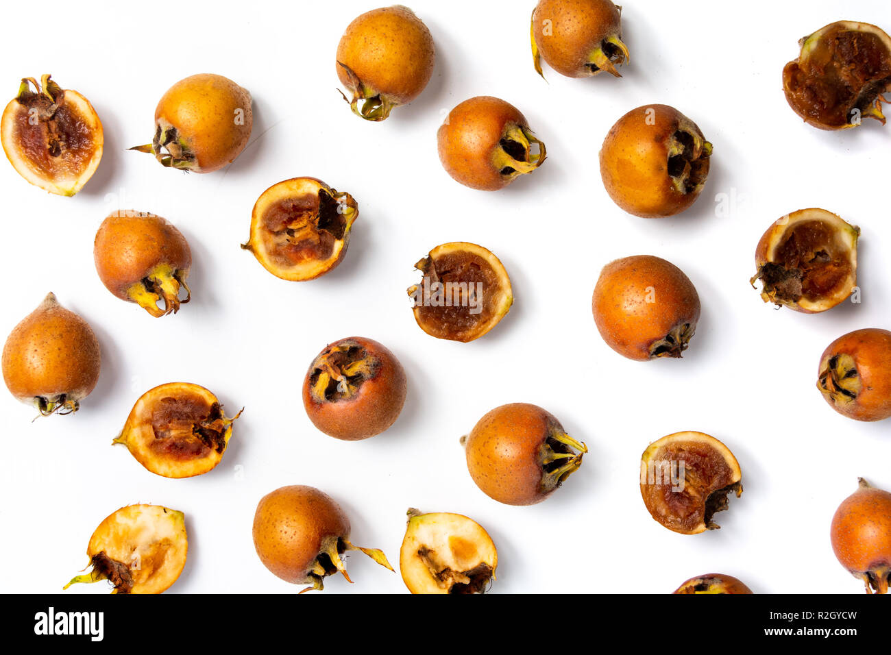 raw medlar on a white background close up Stock Photo - Alamy
