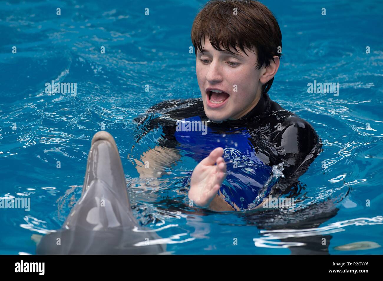 Boy swimming pool wetsuit hi-res stock photography and images - Alamy