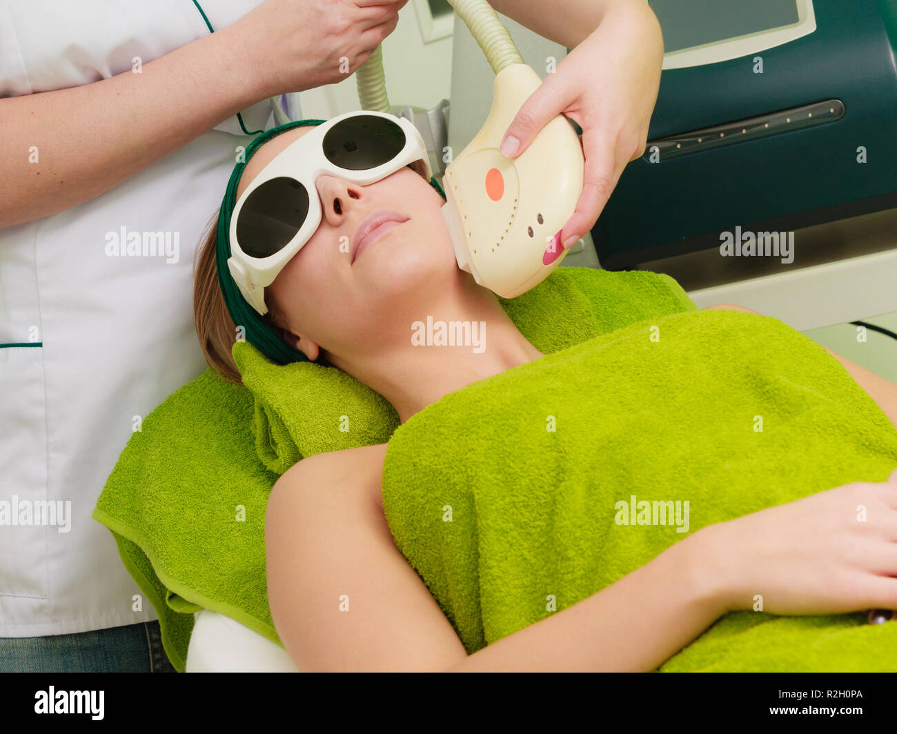 Medical cosmetology, modern cosmetic devices concept. Woman wearing ...