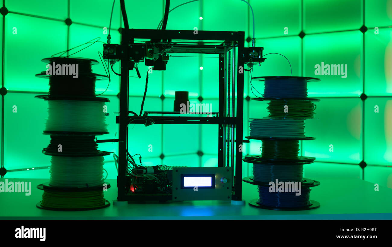 3d printer and plastic filament on color background Stock Photo - Alamy