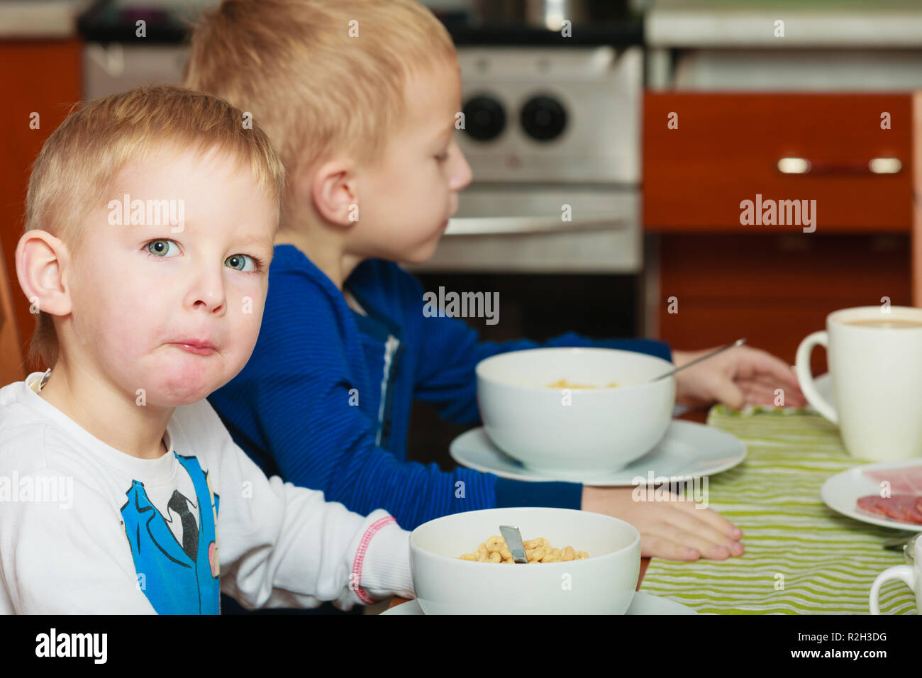 Morning routine in family, healthy diet for children concept. Two boys ...
