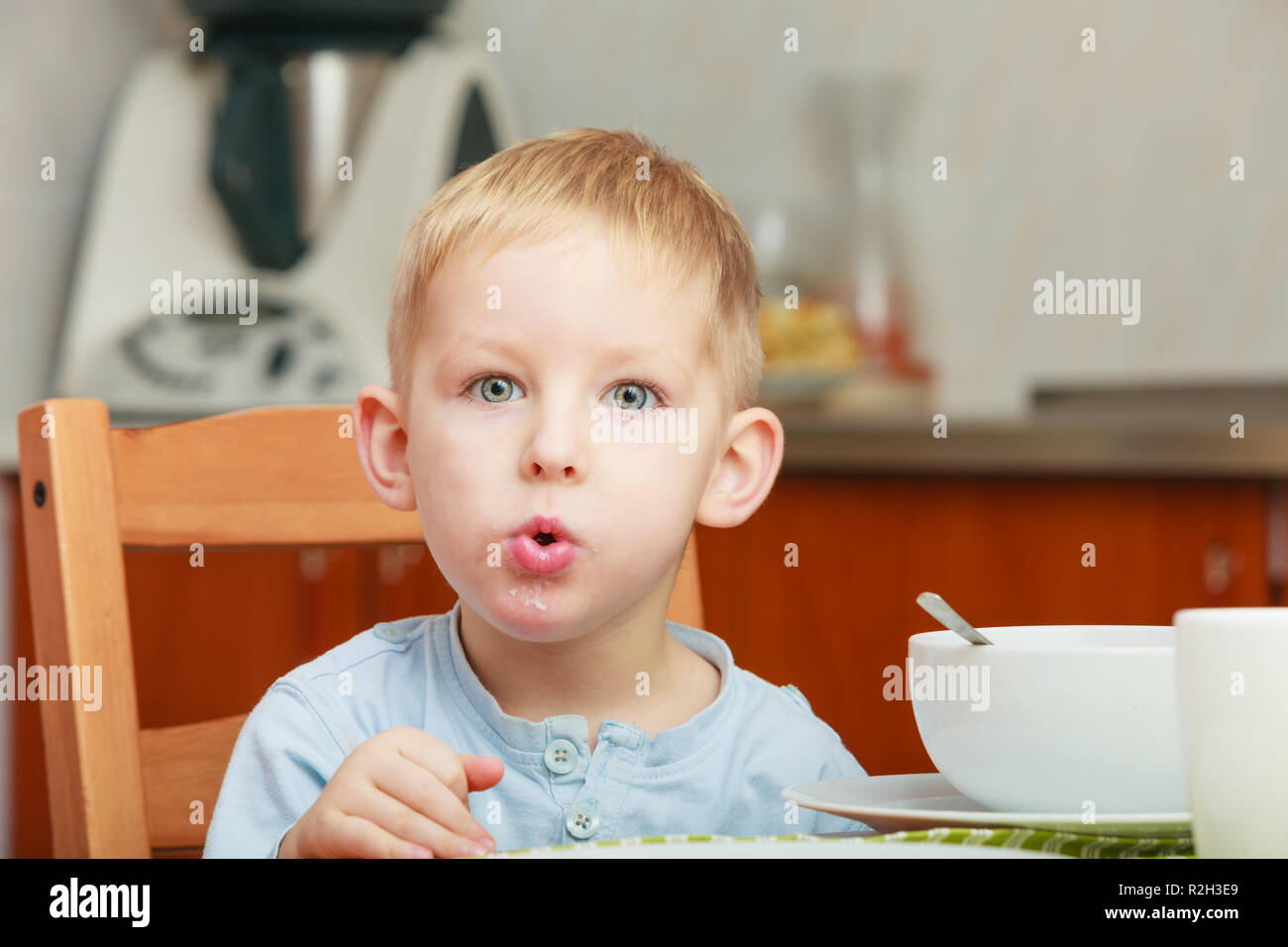Morning routine in family, healthy diet for children concept. Kid boy ...