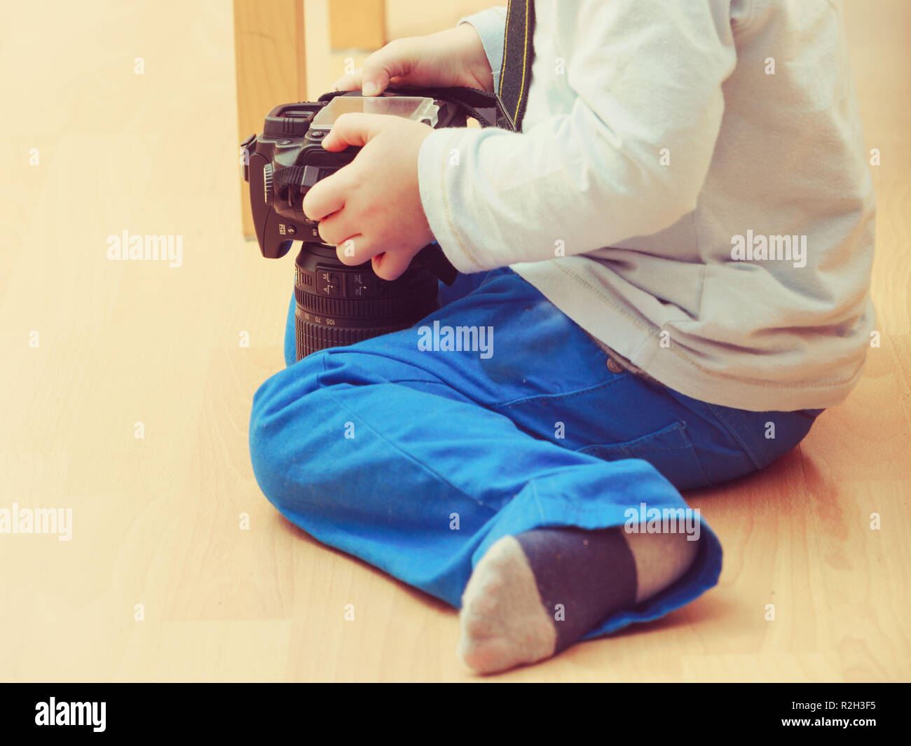 Child passion and hobbies concept. Kid playing with big professional ...