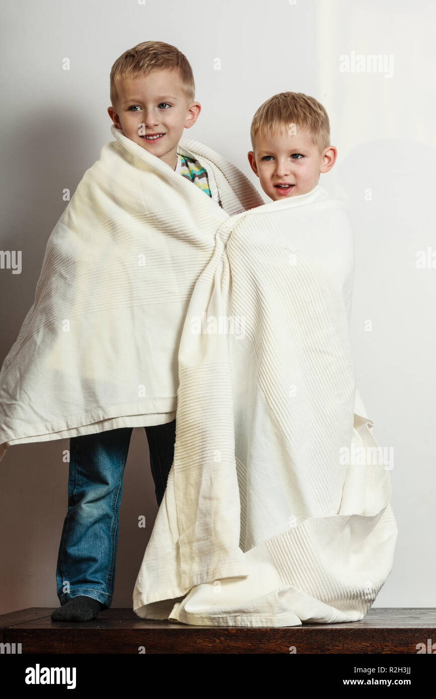 Free time, fun and independence. Little boys play together indoors ...
