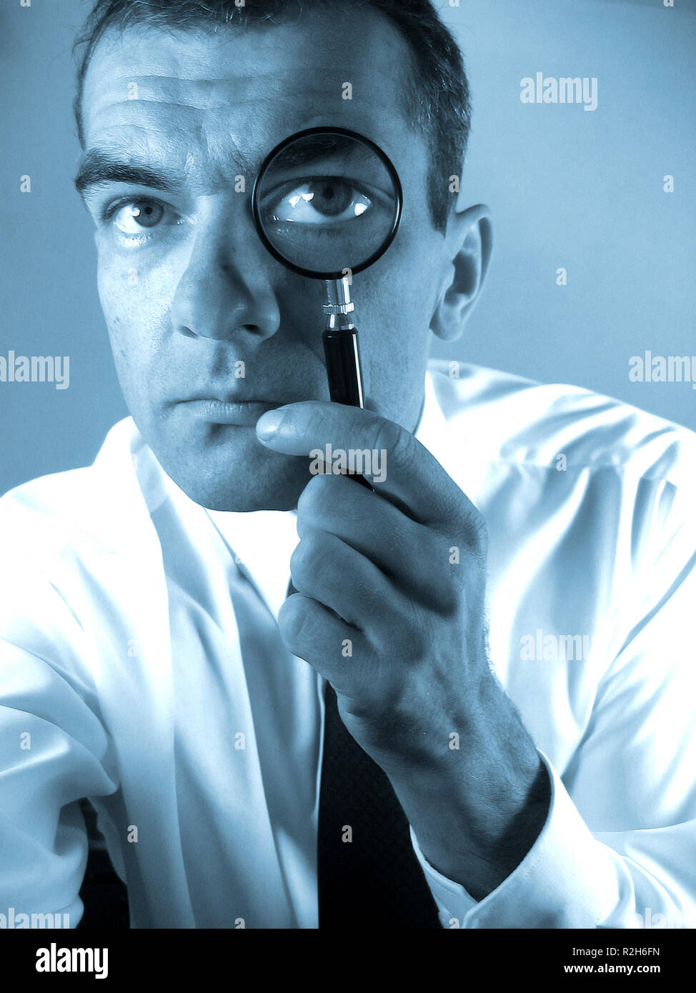 man with magnifying glass Stock Photo - Alamy