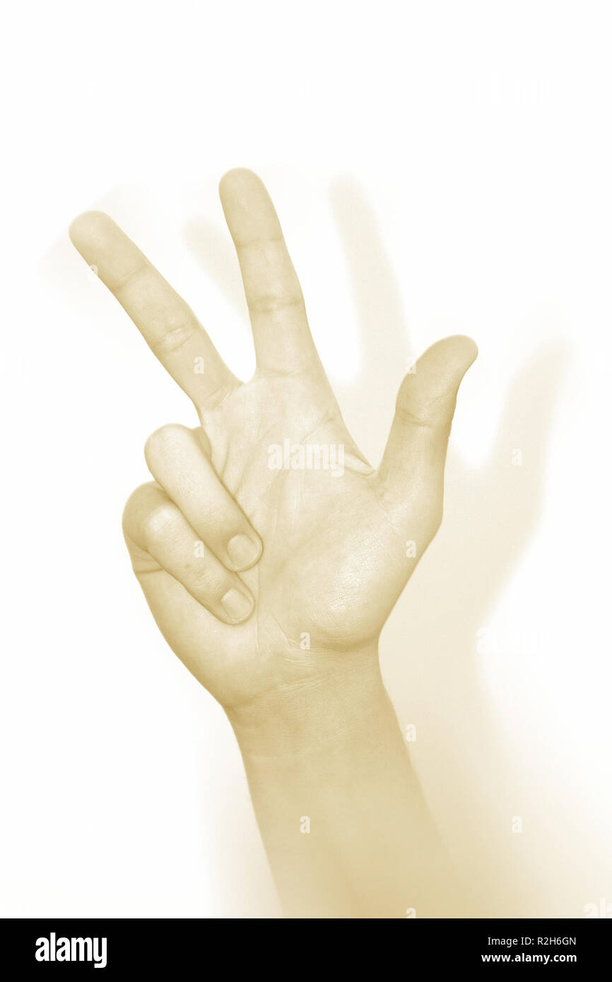 hand in three fingers position Stock Photo - Alamy