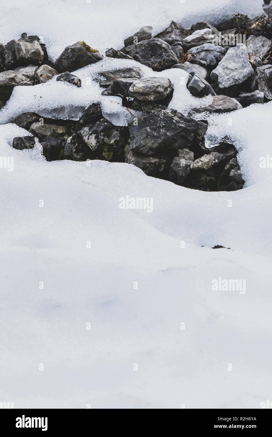 Stones covered by snow Stock Photo - Alamy