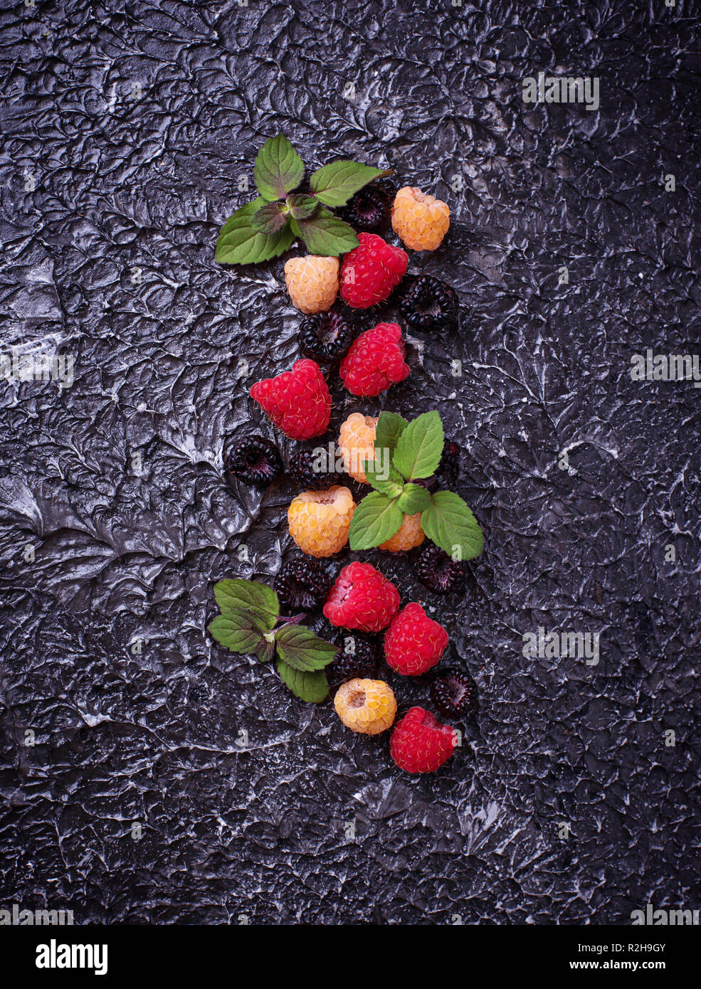 Red, black and yellow raspberry Stock Photo - Alamy