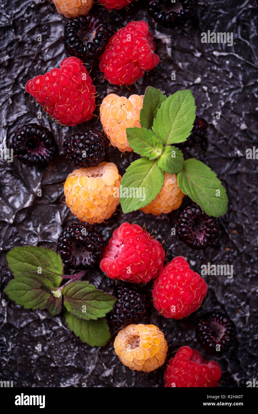 Red, black and yellow raspberry Stock Photo - Alamy