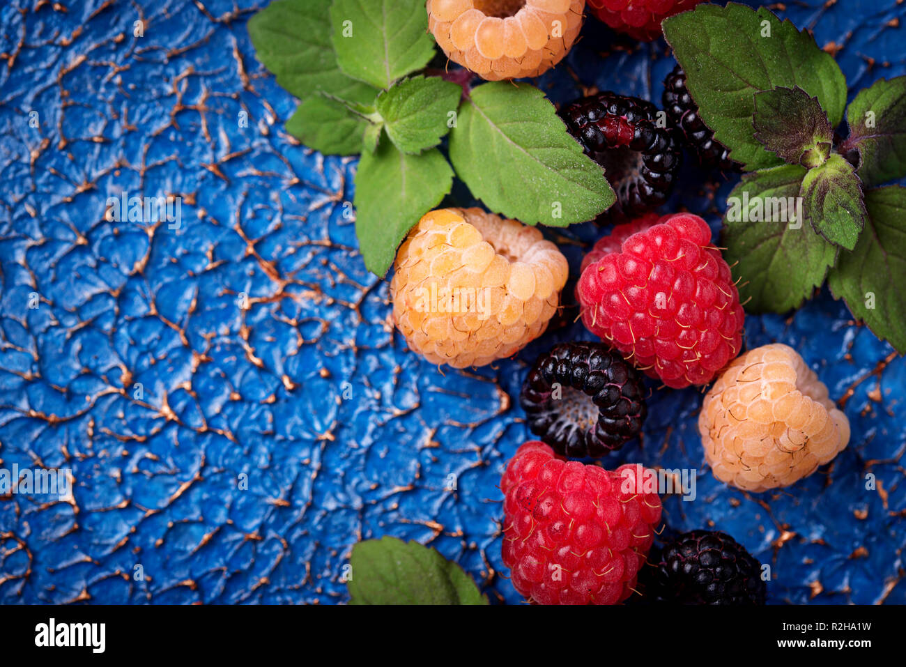 Red, black and yellow raspberry Stock Photo - Alamy