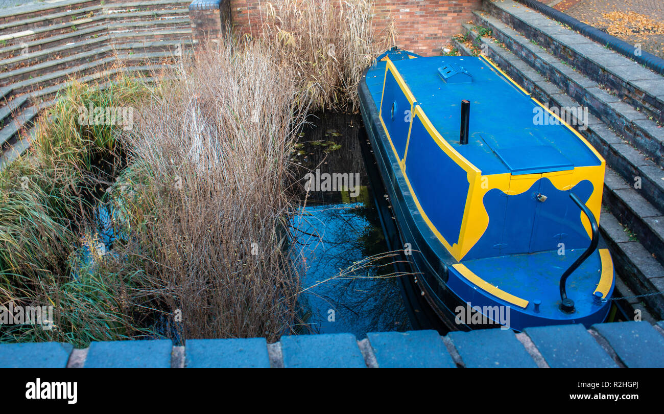 A small blue Canal boat docked at the side of Birmingham canal Stock ...