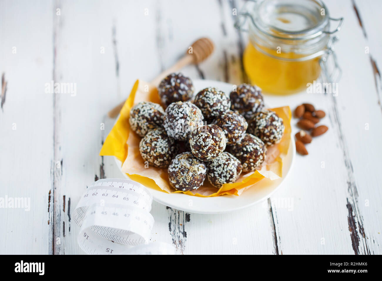 healthy energy organic bites with nuts, dates, honey and sesame in a ...