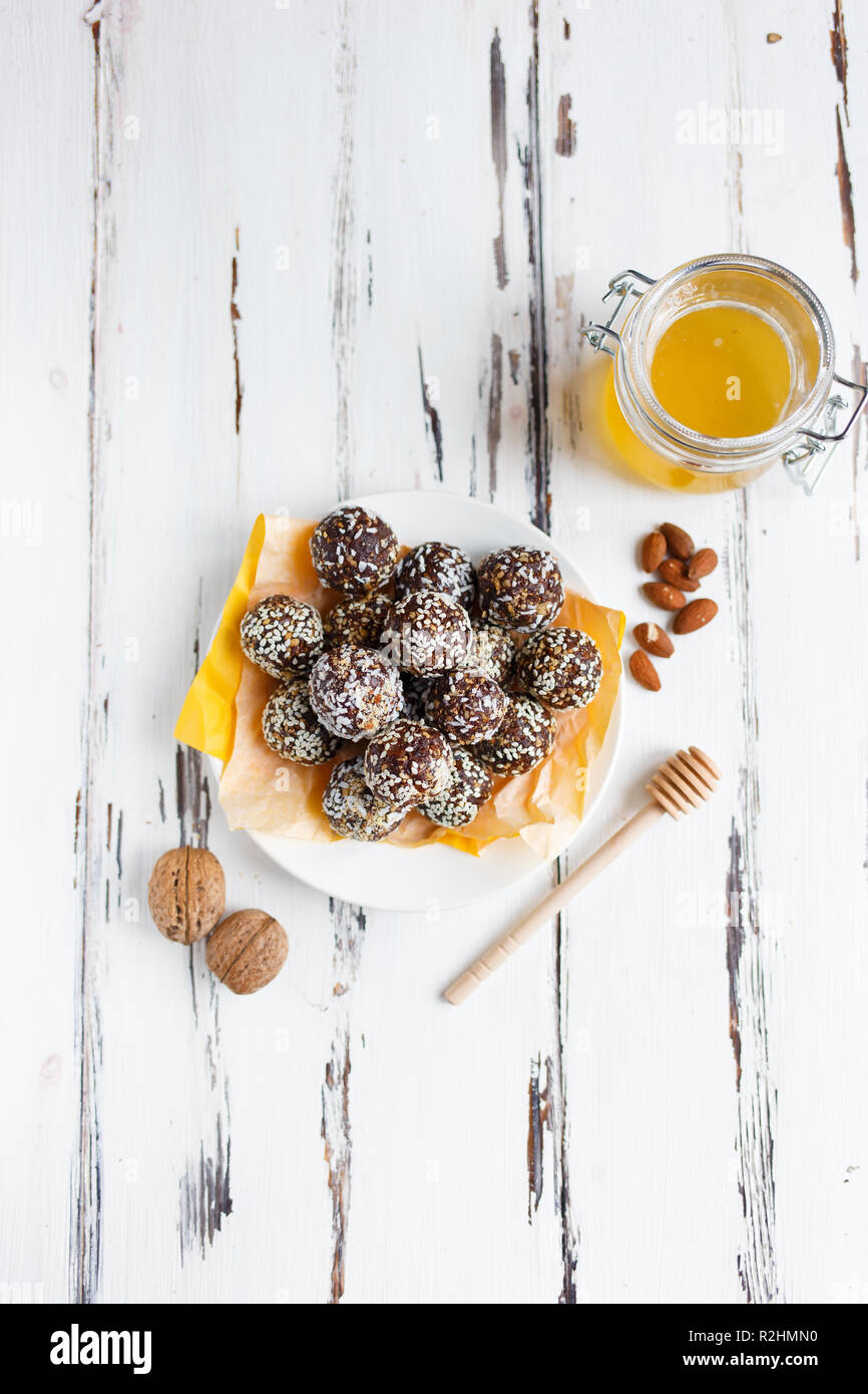healthy energy organic bites with nuts, dates, honey and sesame in a ...