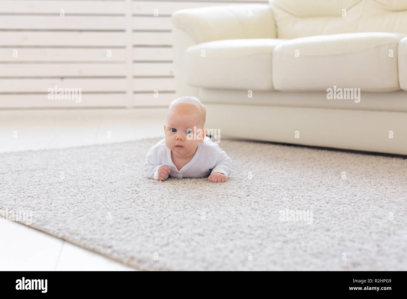Baby, childhood, people concept - Portrait of a crawling baby on the ...