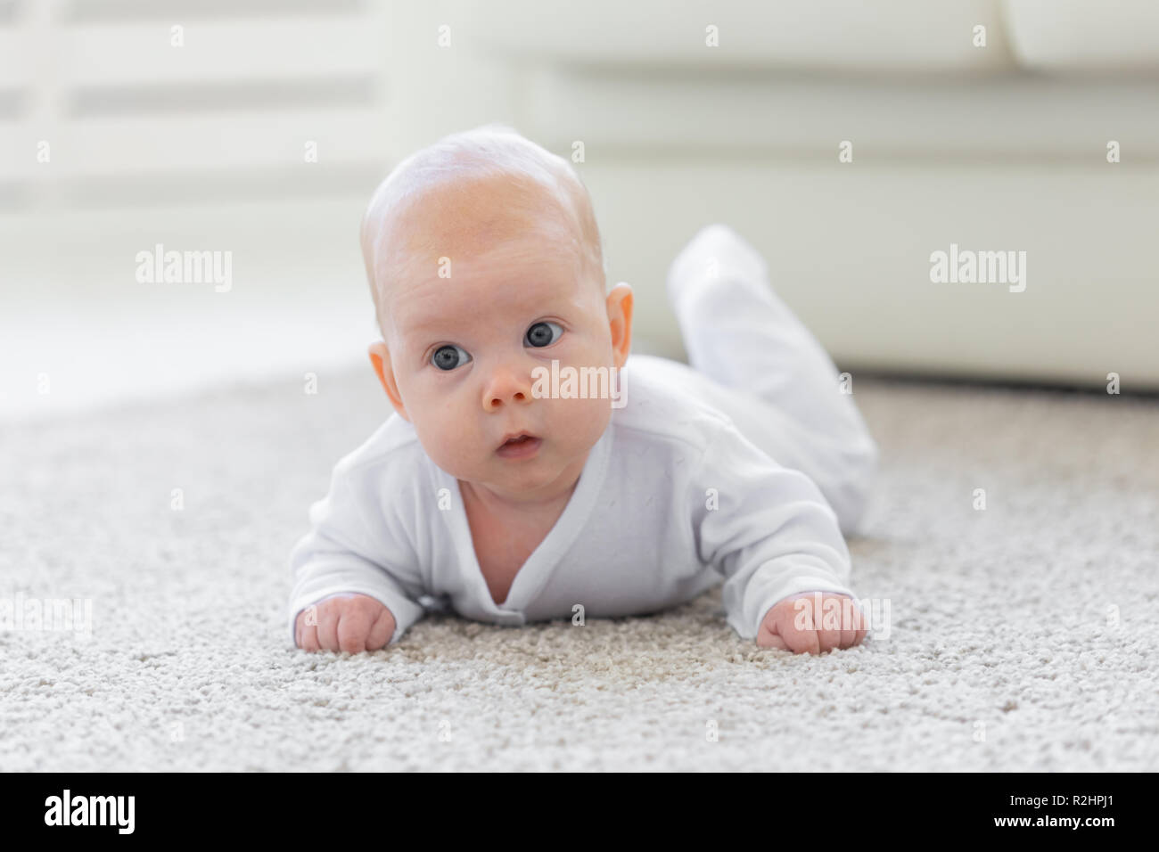 Baby, childhood, people concept - Portrait of a crawling baby on the ...