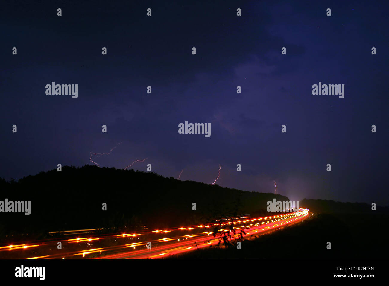 lightning over highway Stock Photo - Alamy