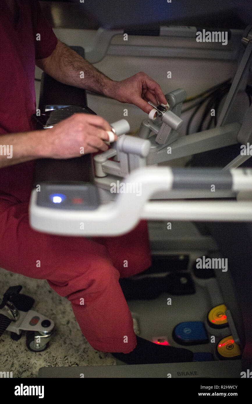 Robotic surgeon da Vinci Xi robot operating a surgical procedure of ...