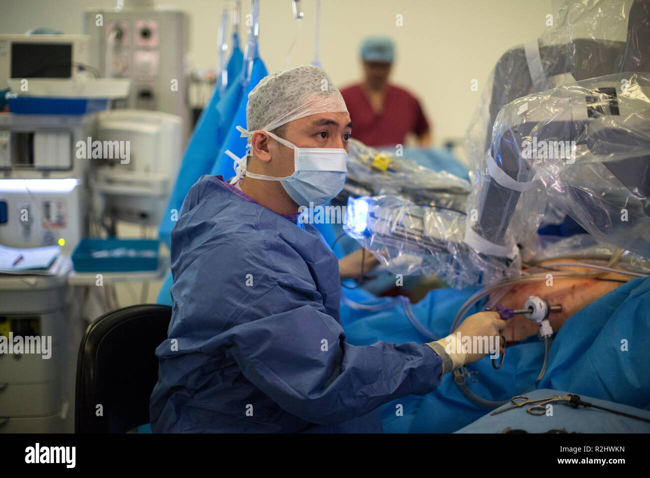 Robotic surgeon da Vinci Xi robot operating a surgical procedure of ...