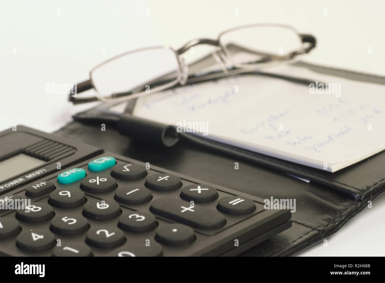 calculator with notepad Stock Photo - Alamy