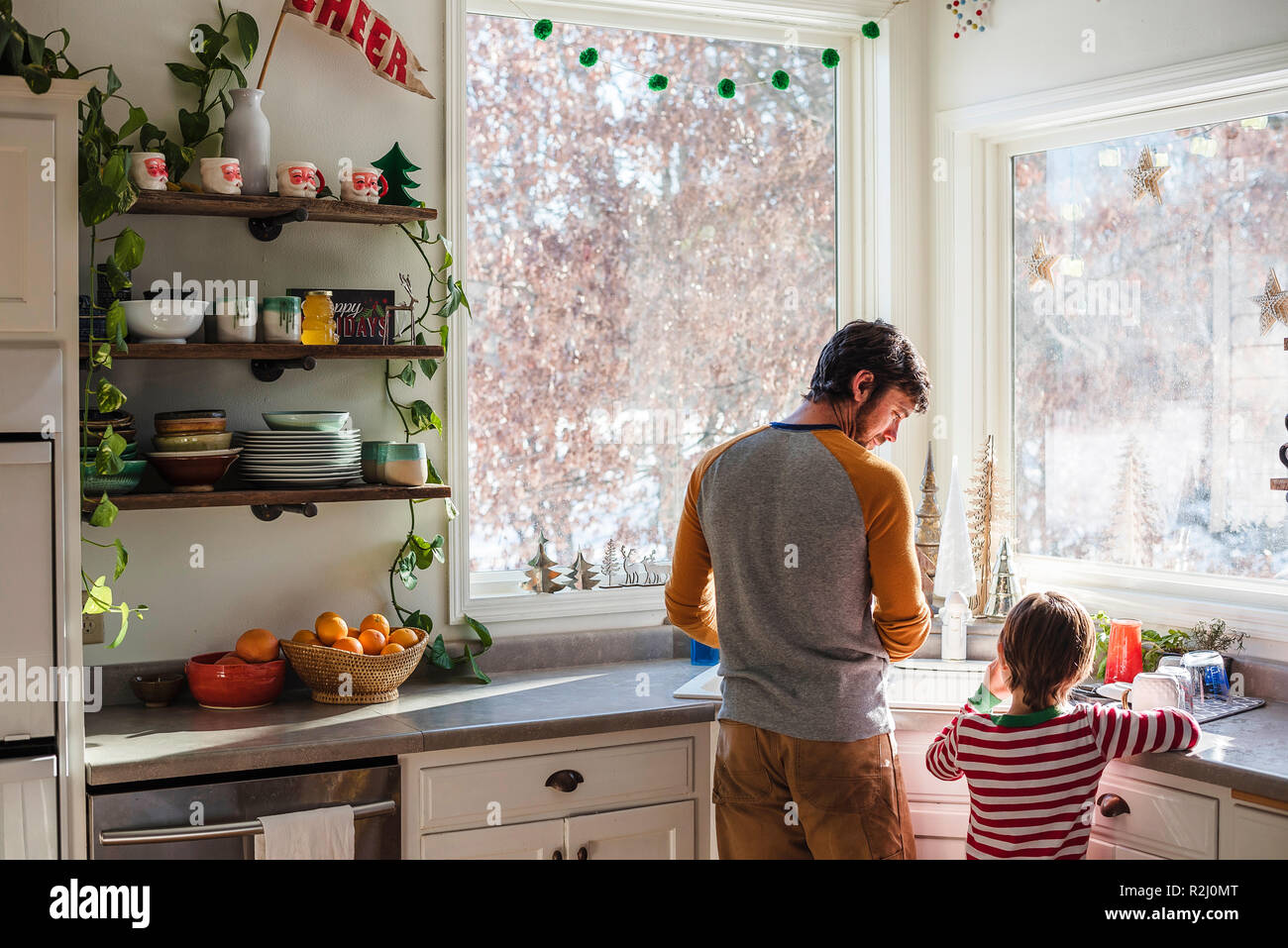 Father and son washing up the dishes hi-res stock photography and ...