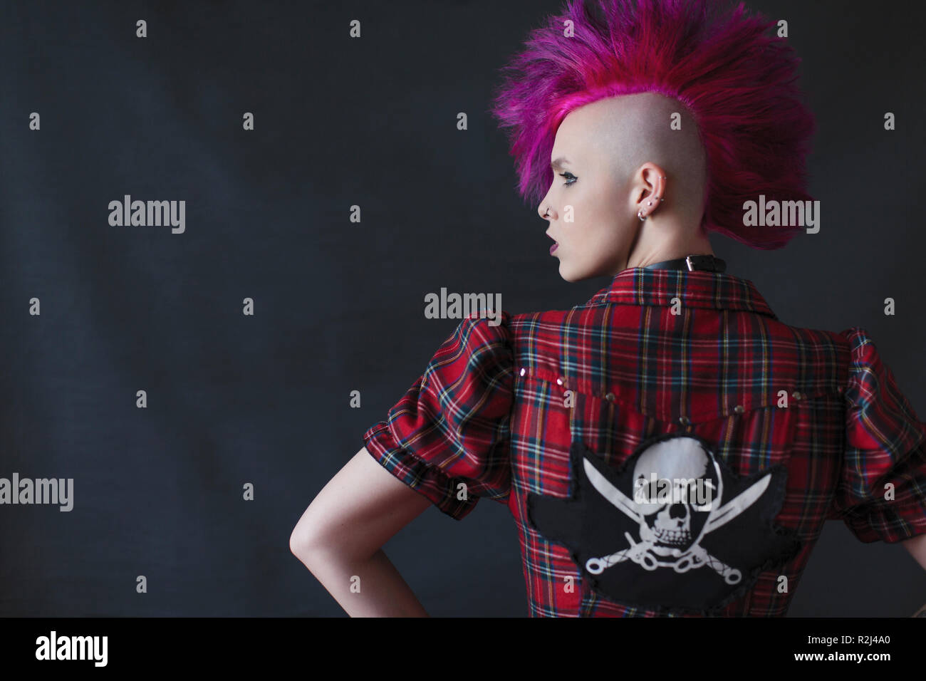 Confident, cool young woman with pink mohawk Stock Photo - Alamy