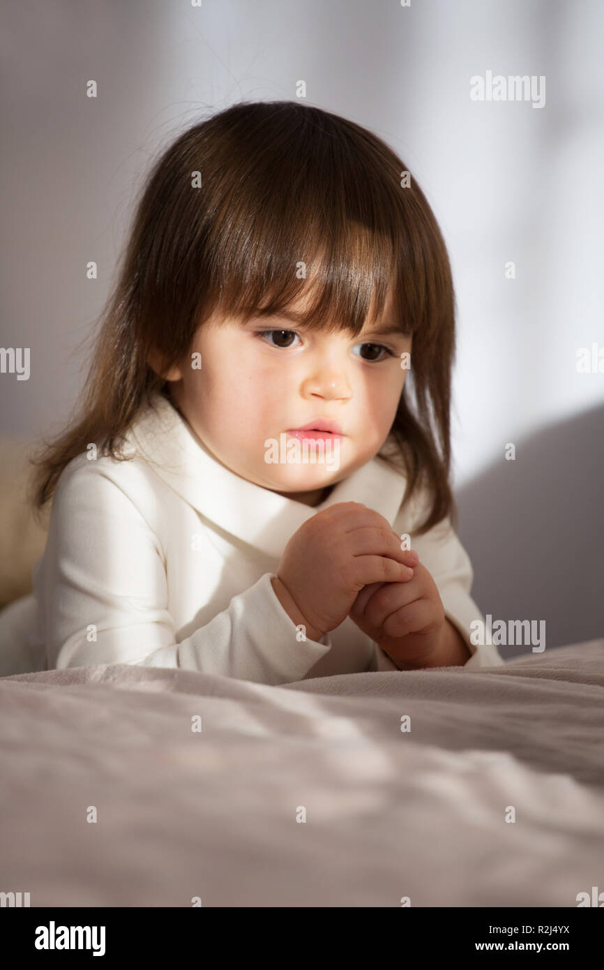Little girl praying in the morning at home . Little caucasian girl hand ...