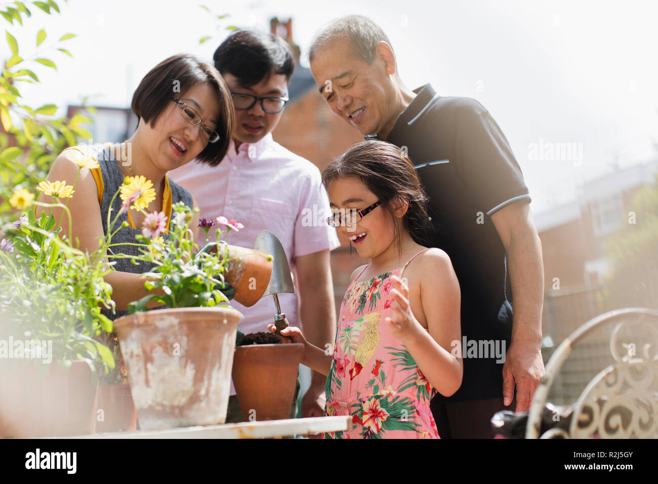 Daughter helping mother gardening hi-res stock photography and images ...