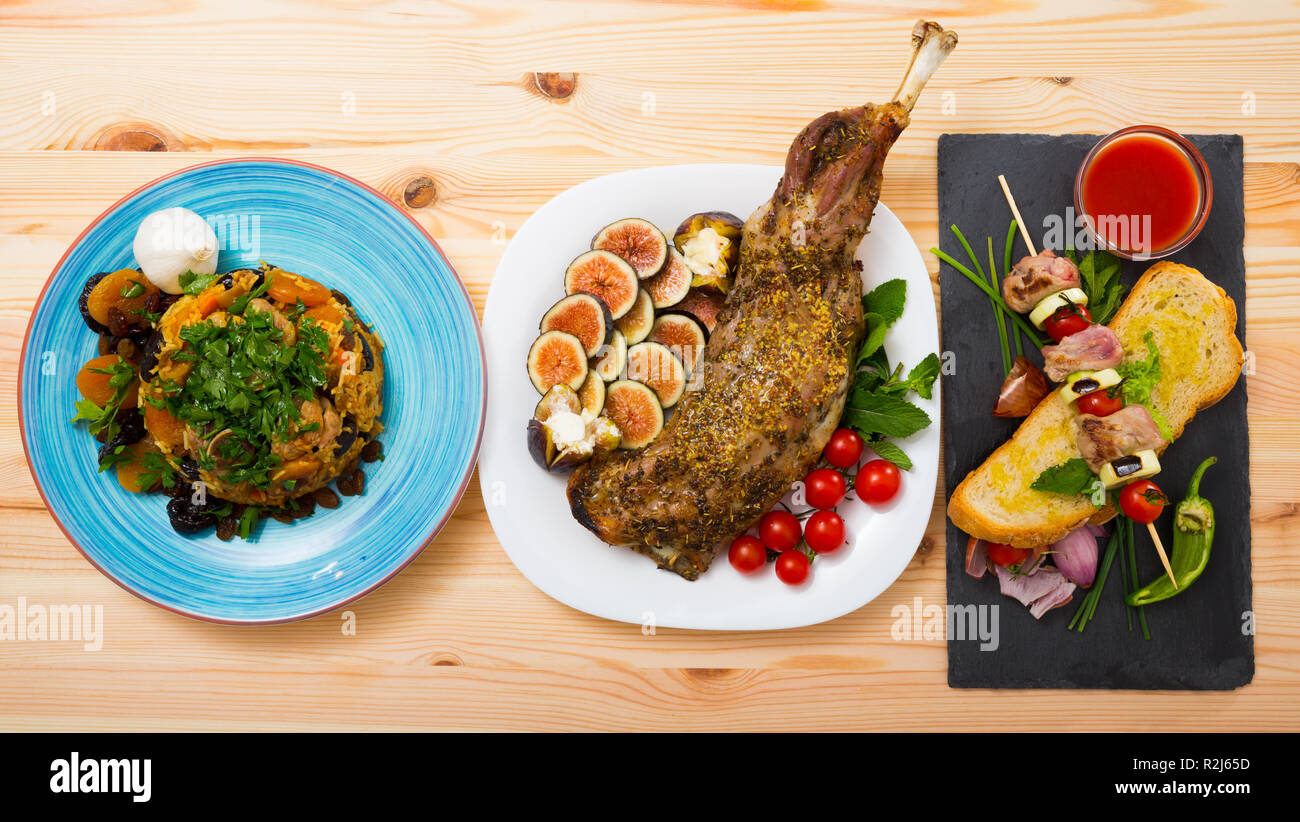 Top view of set of assorted lamb dishes on wooden table Stock Photo - Alamy