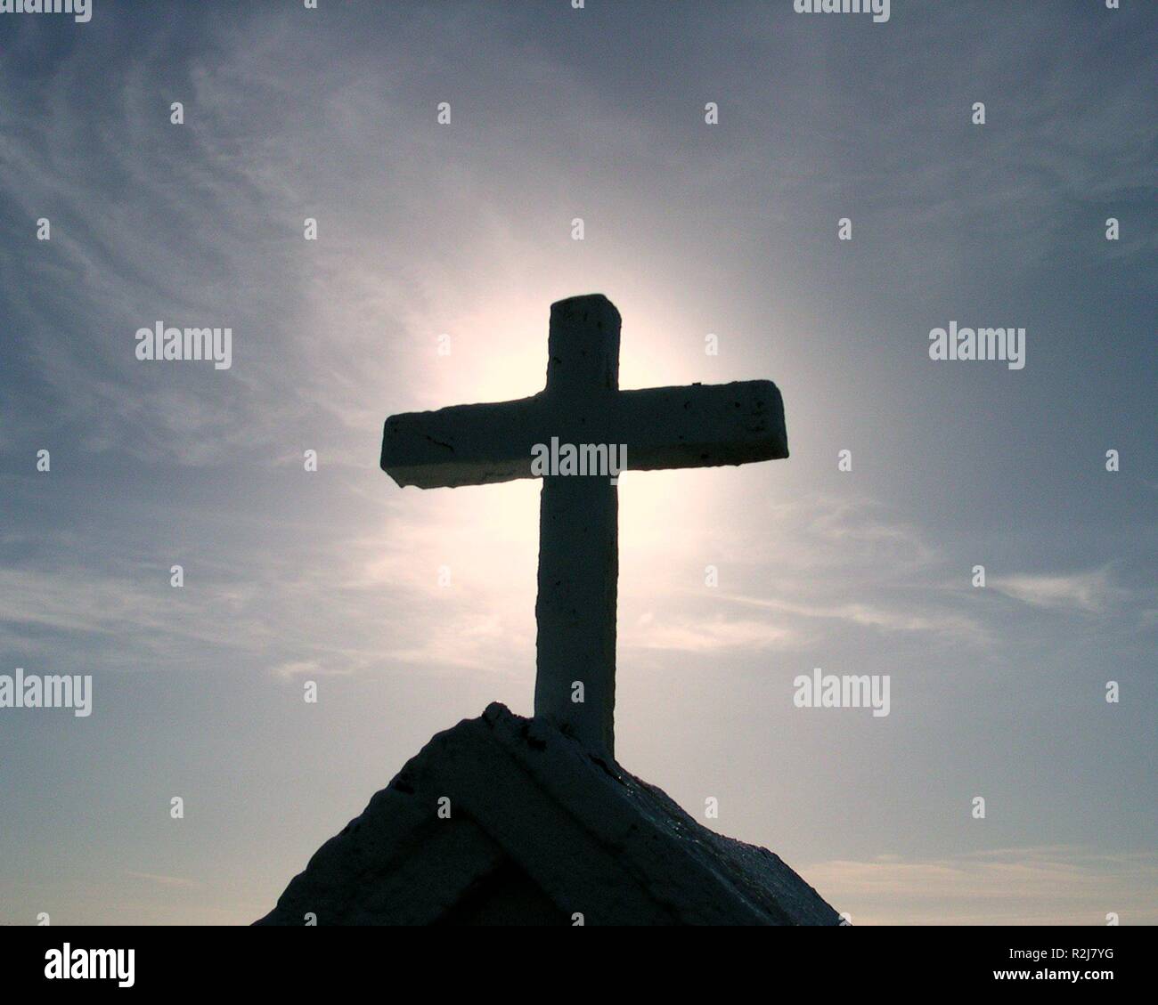 sun behind cross Stock Photo - Alamy