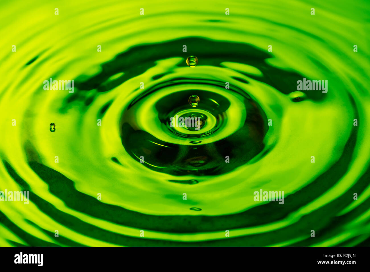 Water drop falling into water make waves Stock Photo - Alamy