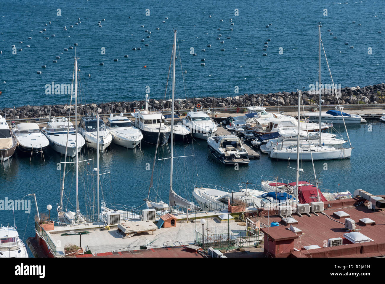 Yachts are in the port in Naples, Italy. Port city on a clear Sunny day ...
