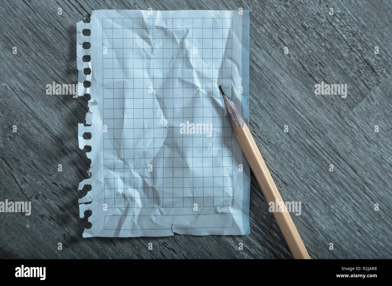 Empty crumpled page torn from notebook lying on wooden surface Stock ...